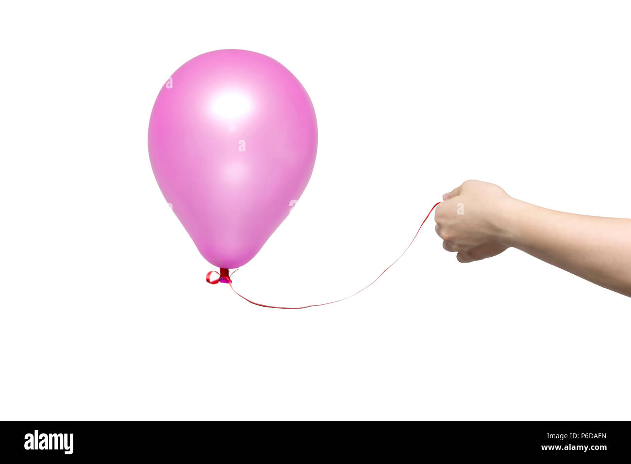 Single pink balloon holded in a hand isolated on the white background ...