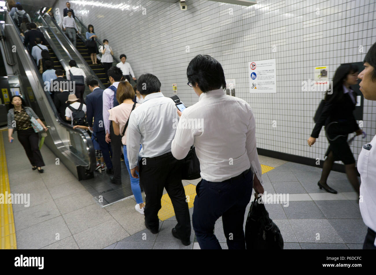 Japanese commuters at rush-hour Tokyo Japan Stock Photo - Alamy