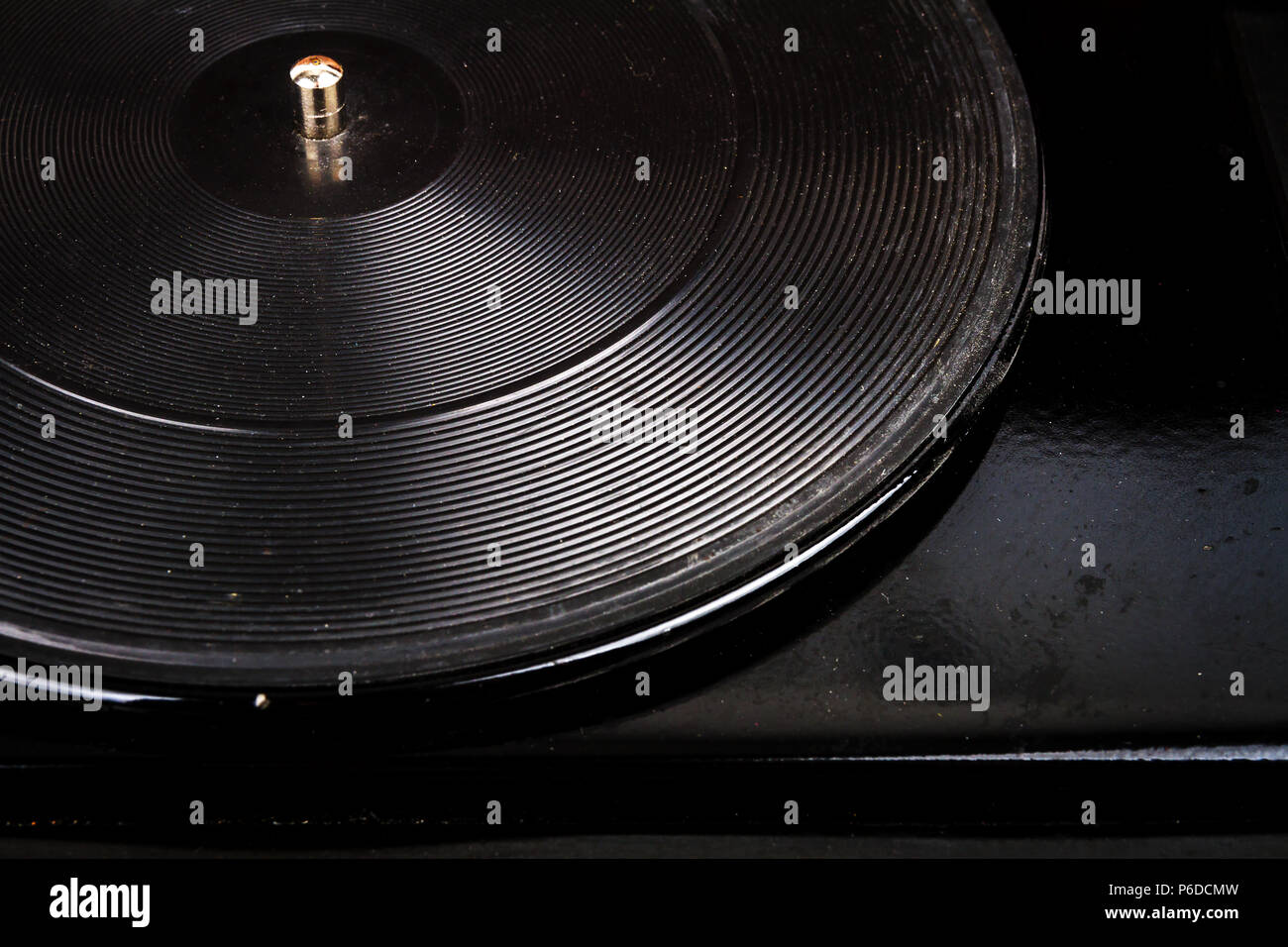 Close up shot of old turntable rubber platter with the spindle Stock ...