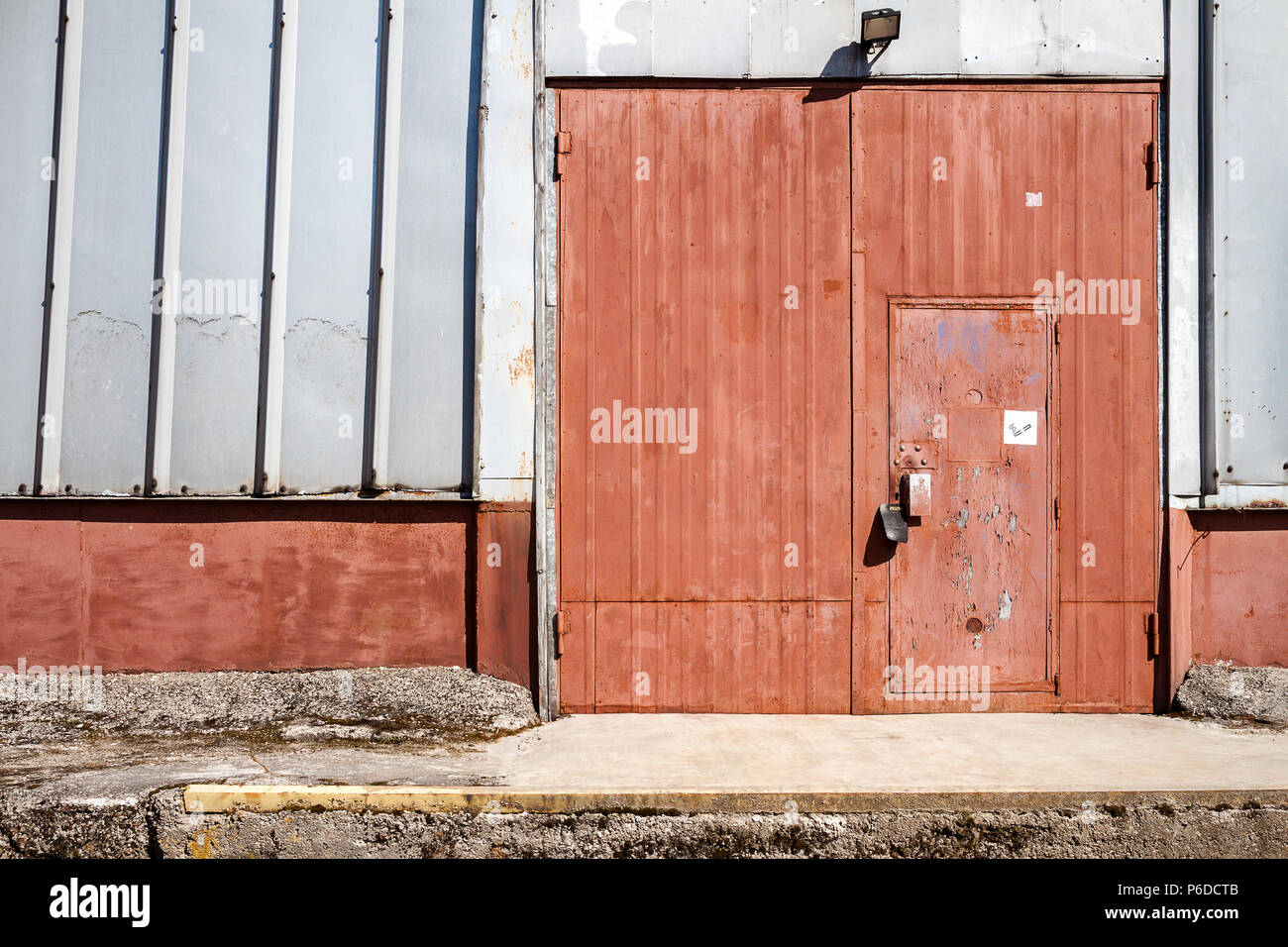 Old metal warehouse door, hangar gate. Industrial iron door Stock Photo ...