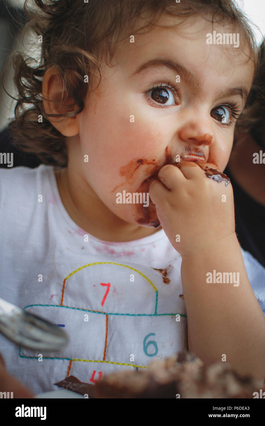 Girl dirty mouth eating chocolate hi-res stock photography and images ...