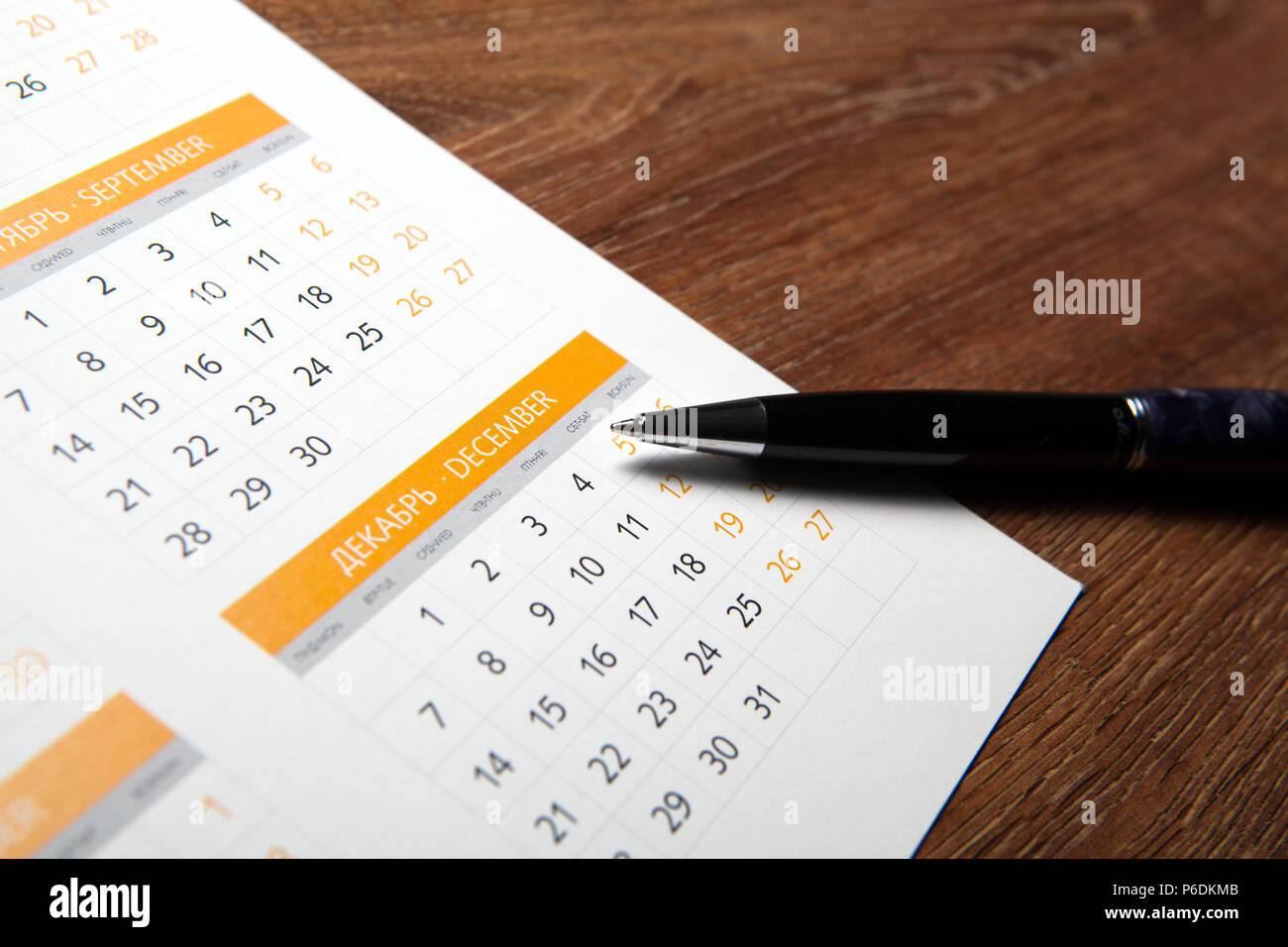 wall calendar with pen closeup and macro Stock Photo - Alamy