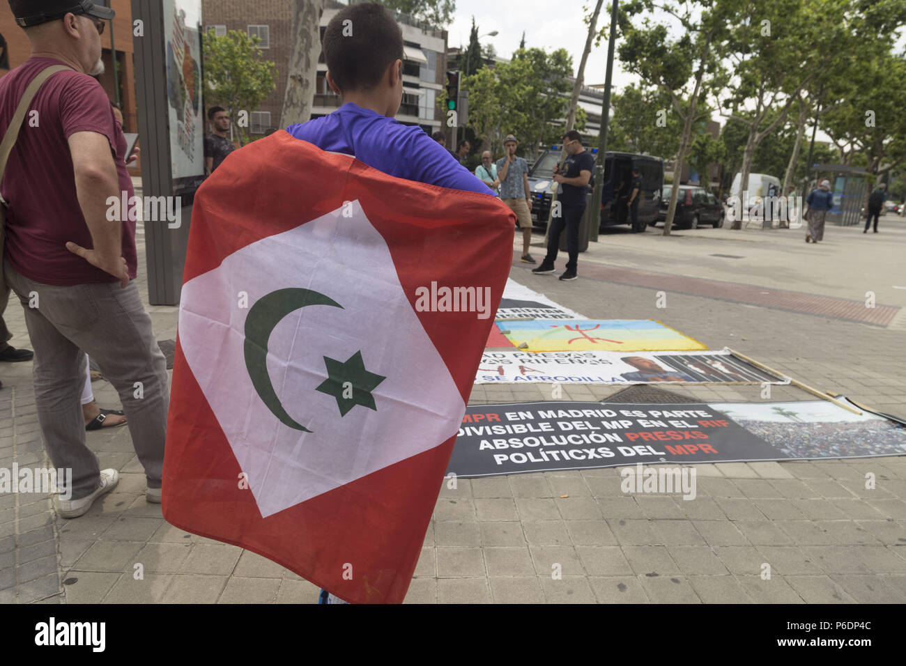 Madrid, Spain. 29th June, 2018. A kid is seen covered with the flag of ...