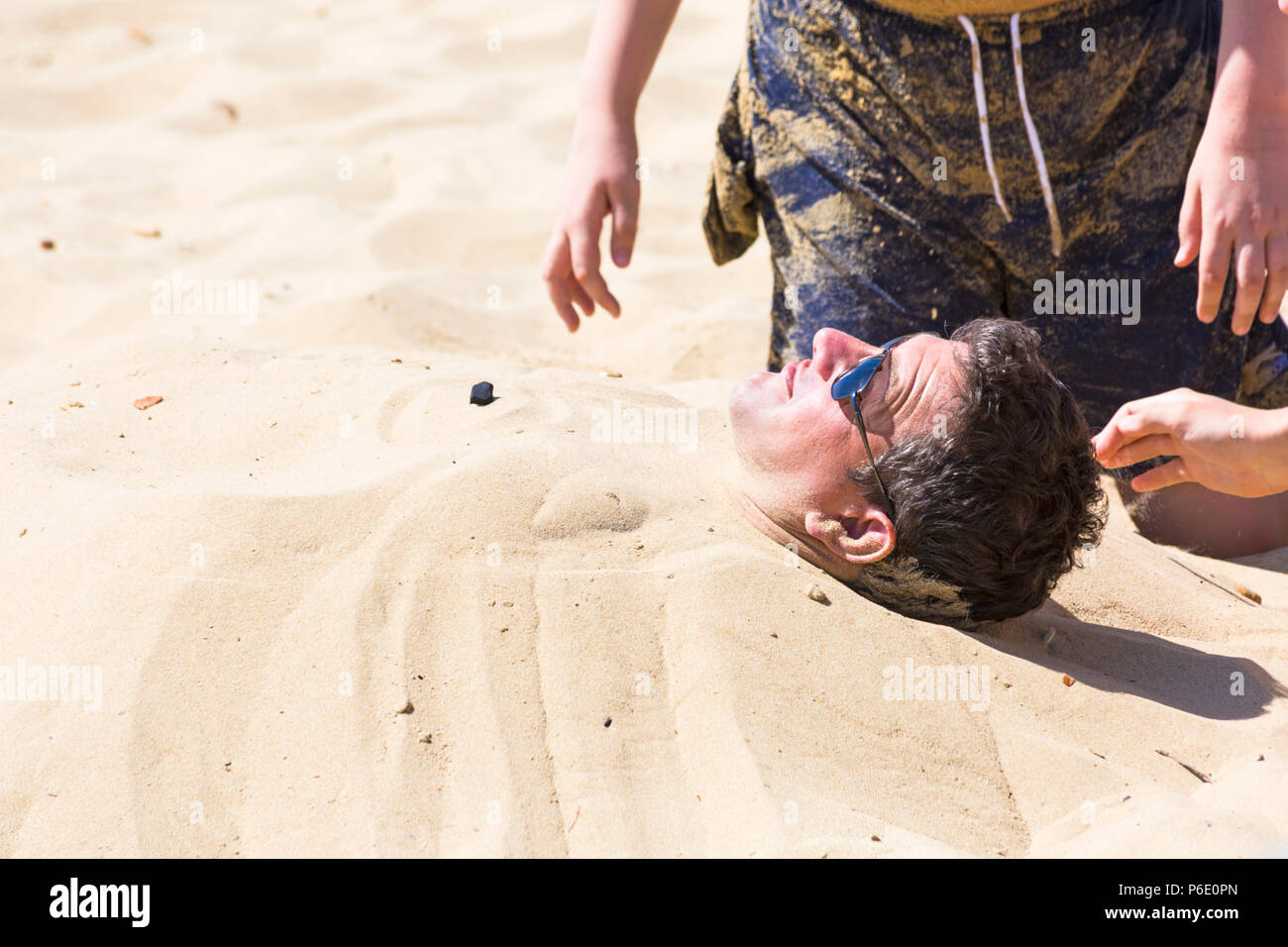 Buried up to neck hi-res stock photography and images - Alamy