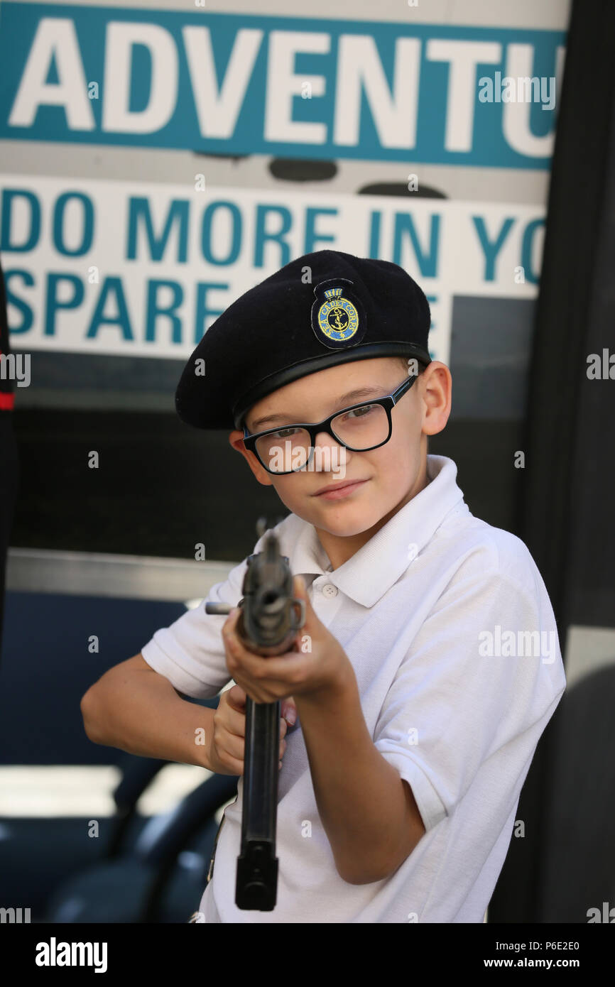Manchester, UK, 30 June 2018. A young lad handling a gun during ...