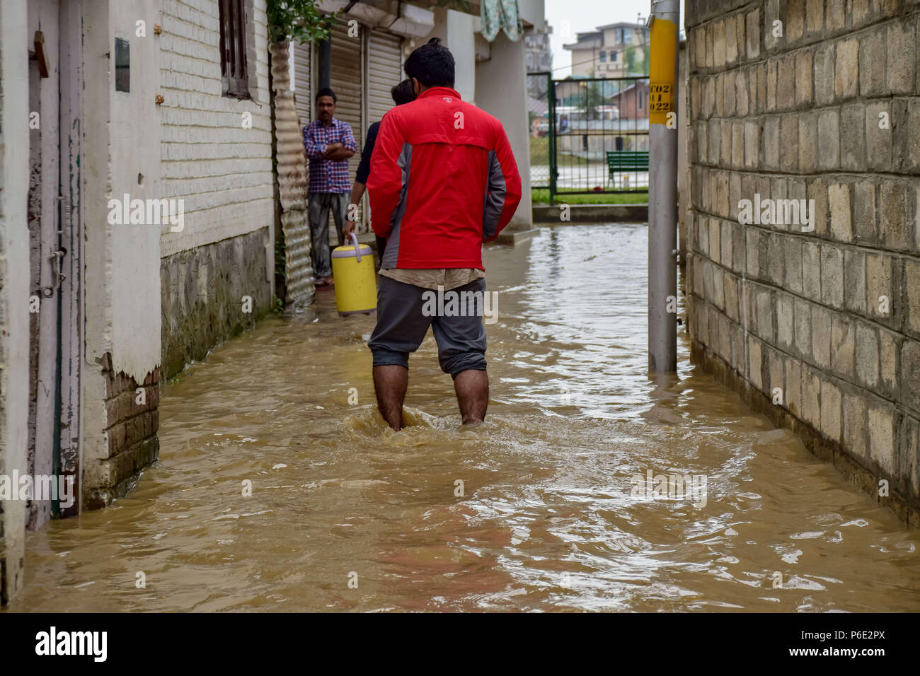 Indian people walk in flood hi-res stock photography and images - Alamy