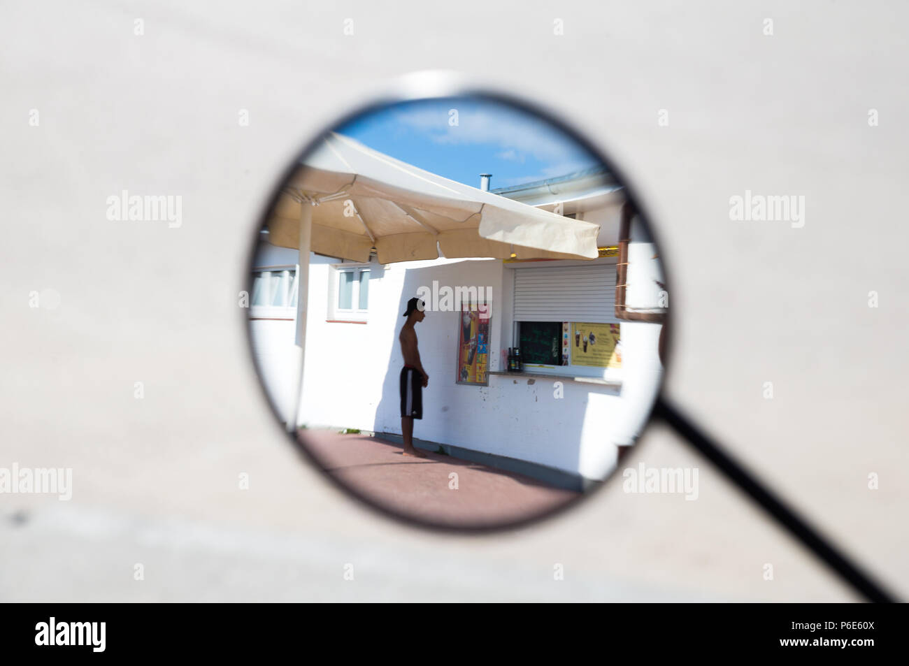Cuxhaven, Germany. 30th June, 2018. A young man looking at the ice ...