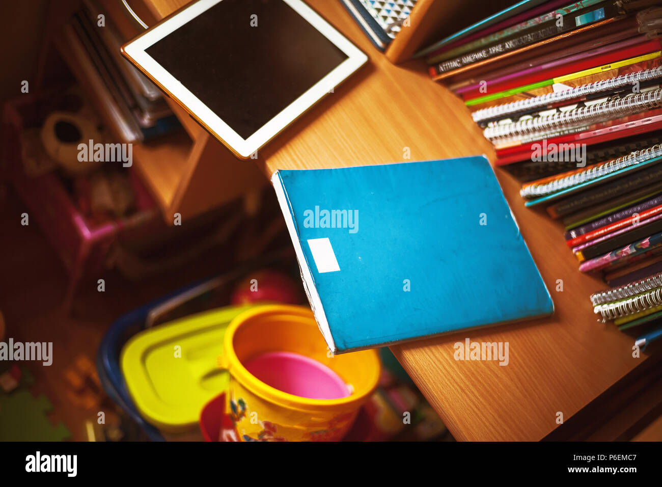 Messy table of a child, closeup view on notes Stock Photo - Alamy