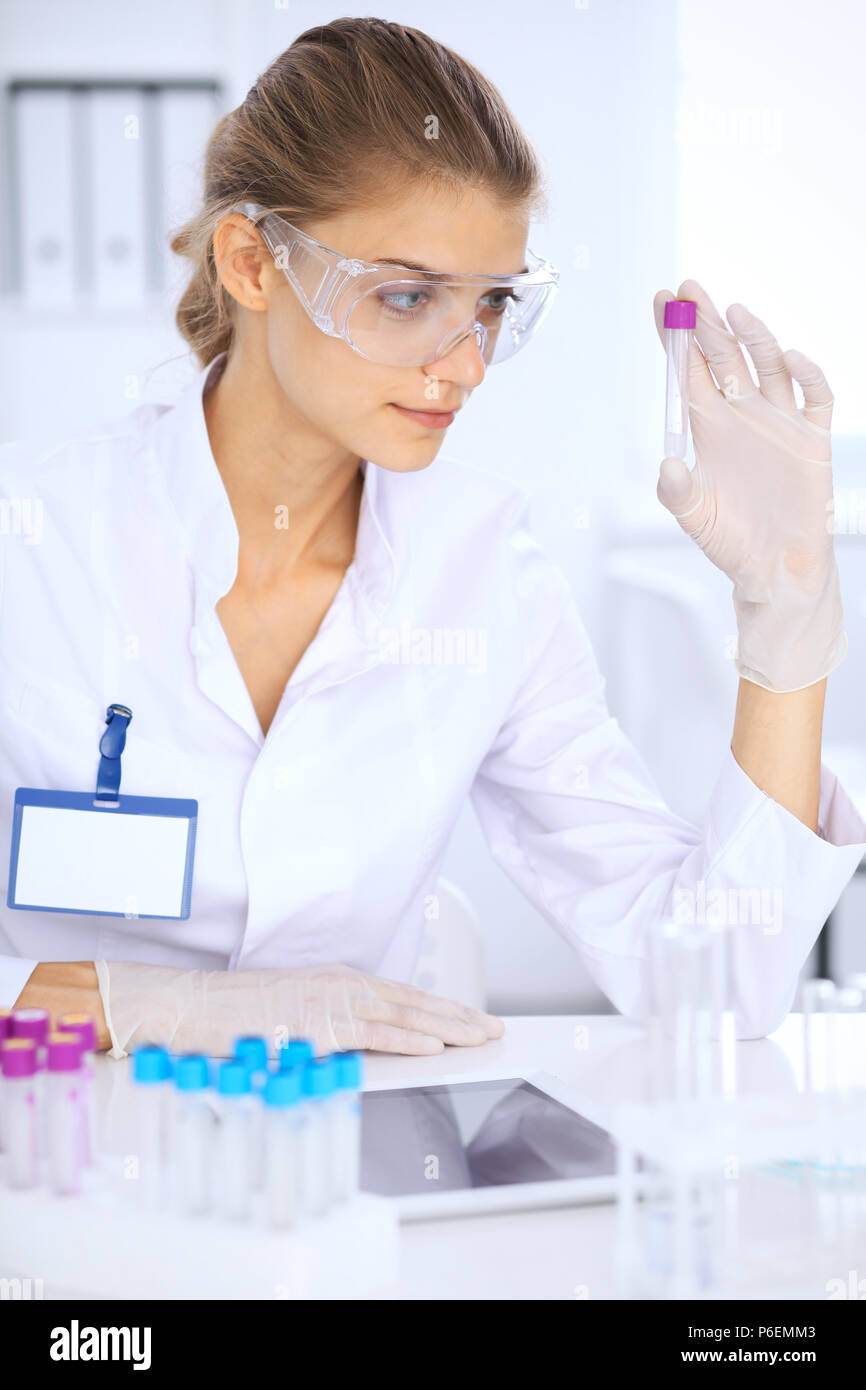 Female scientific researcher or blood test assistant in laboratory ...