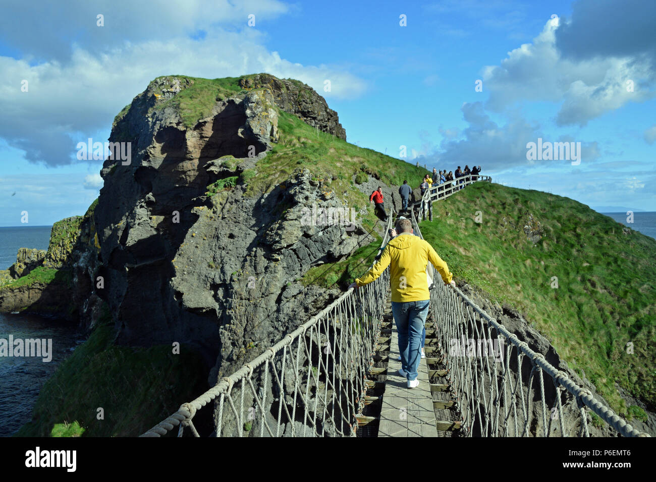 Rope bridge between two cliffs Stock Photo - Alamy