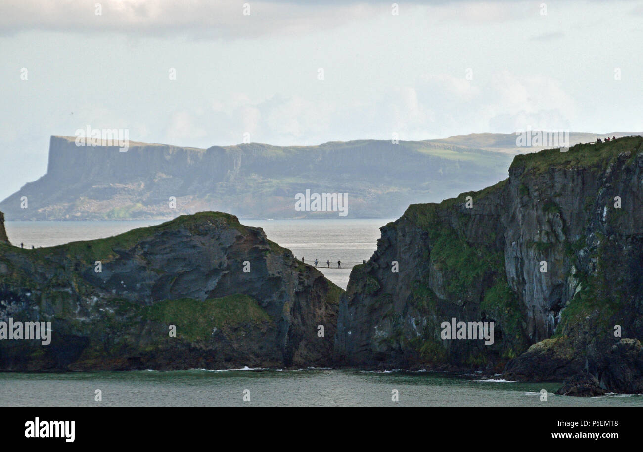 Rope bridge between two cliffs Stock Photo - Alamy