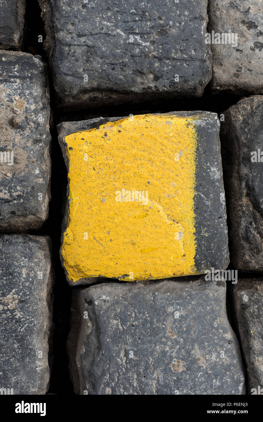 Old yellow and black granite road cubes as background or wallpaper ...