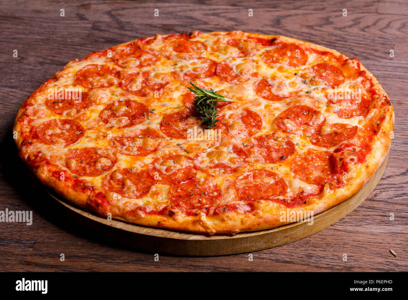 Hot Pepperoni pizza with cheese and tomato Stock Photo - Alamy