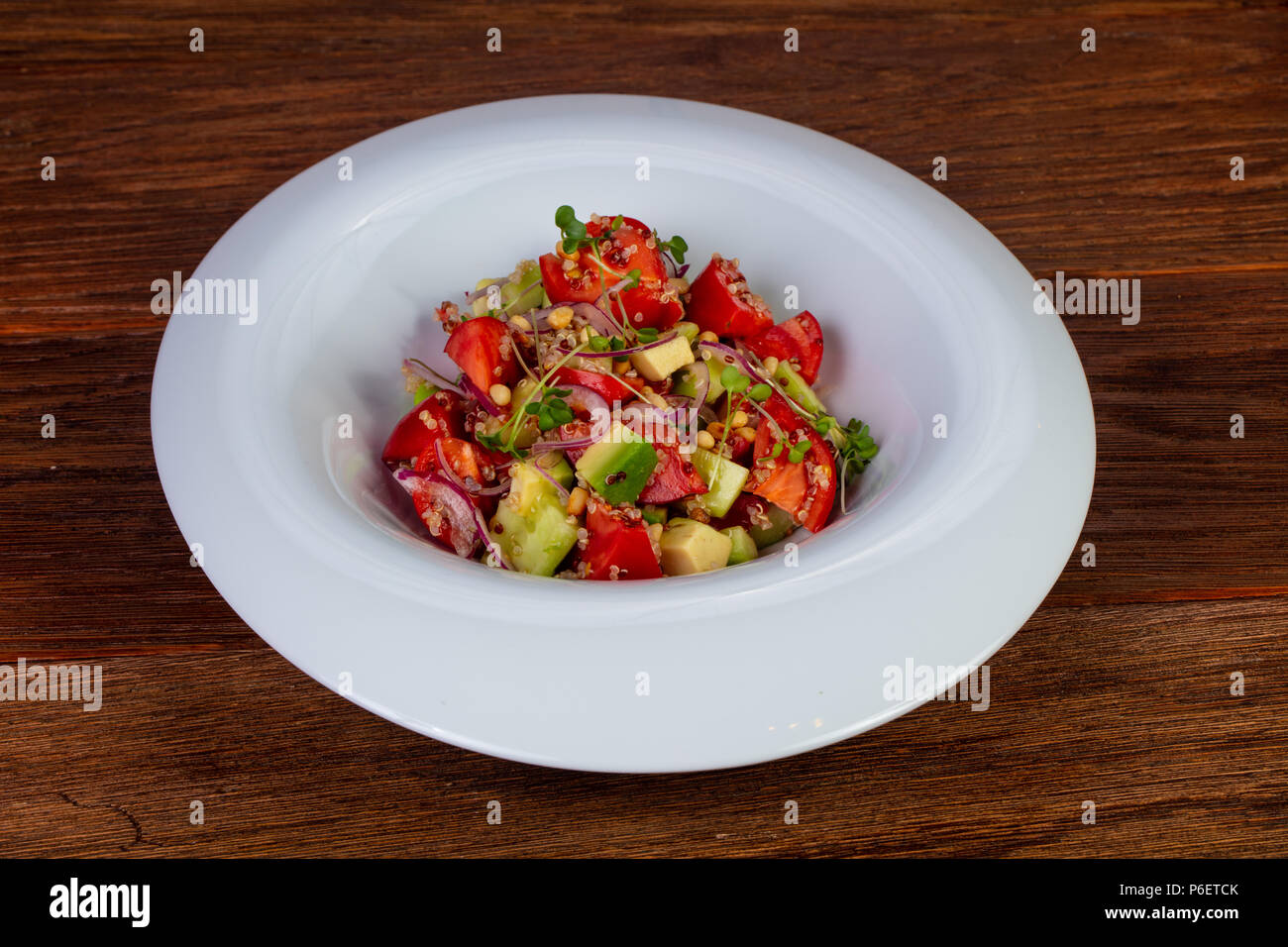 Salad with Kinoa, avocado and vegetables Stock Photo - Alamy