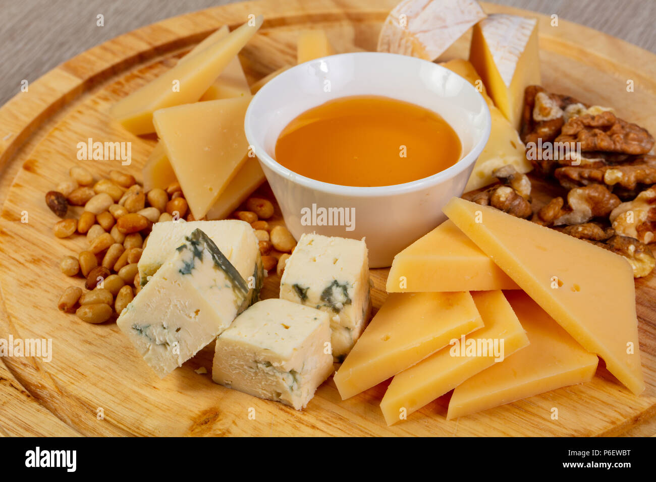 Cheese plate mix with honey Stock Photo - Alamy