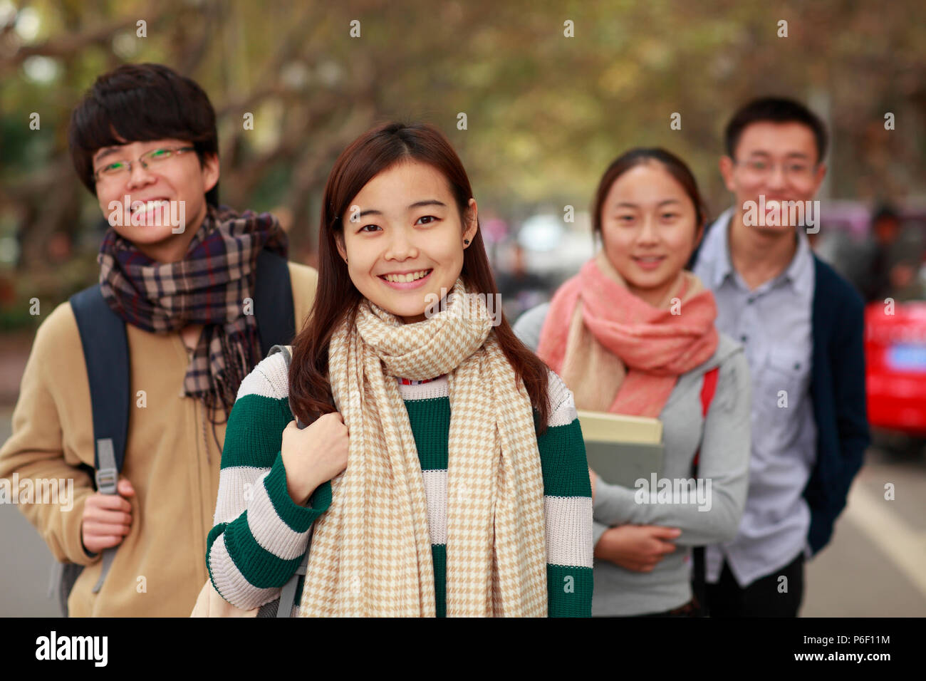 four asian college students in campus Stock Photo - Alamy