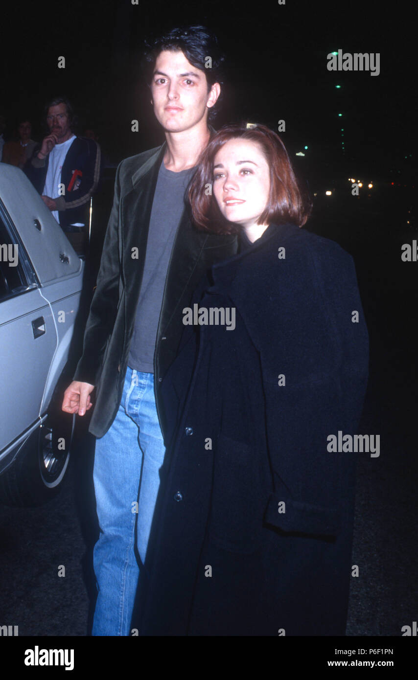 BEVERLY HILLS, CA - DECEMBER 12: (L-R) Actor Josh Evans and actress ...