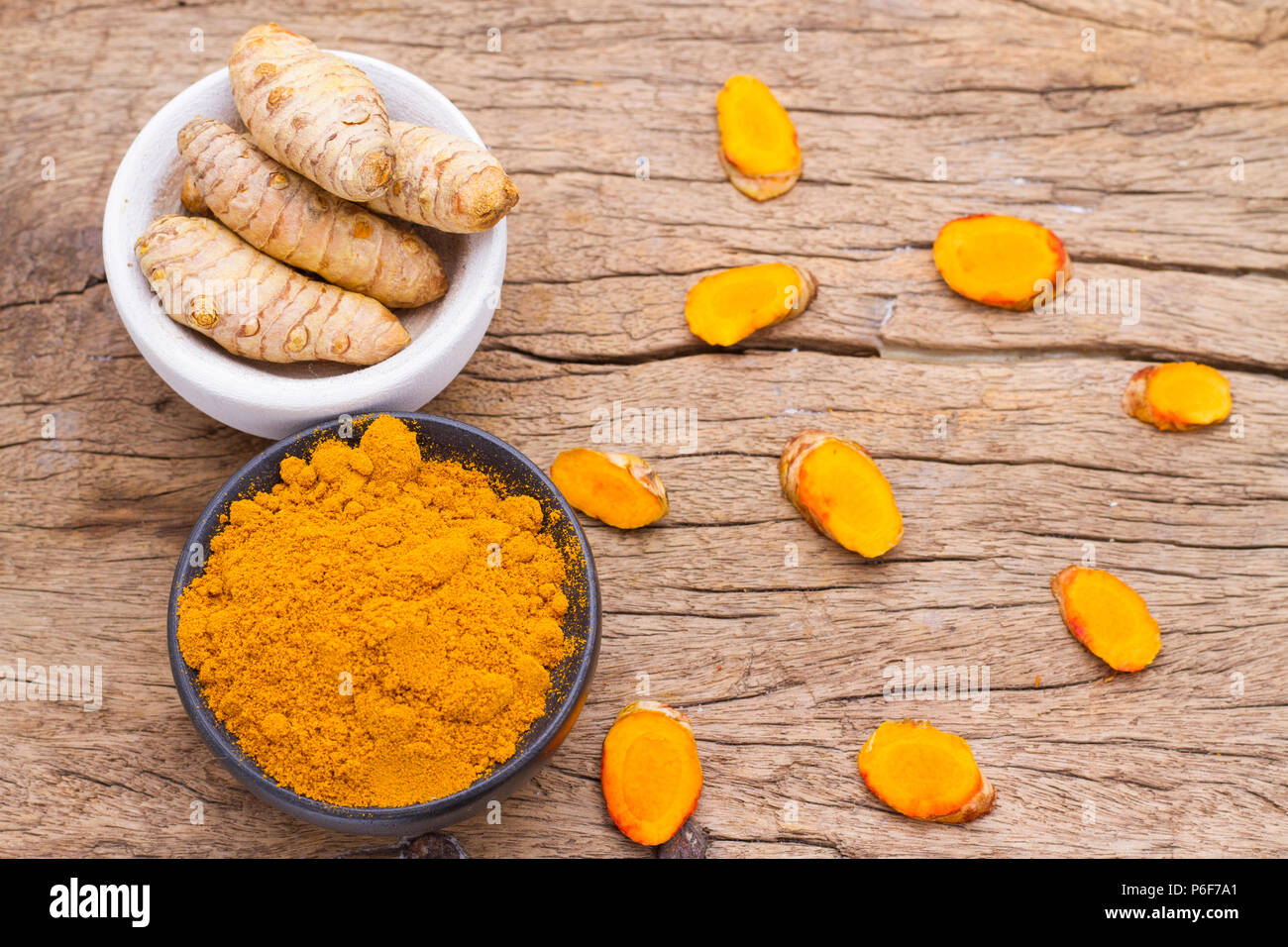 turmeric in bowl on table, top view Stock Photo - Alamy