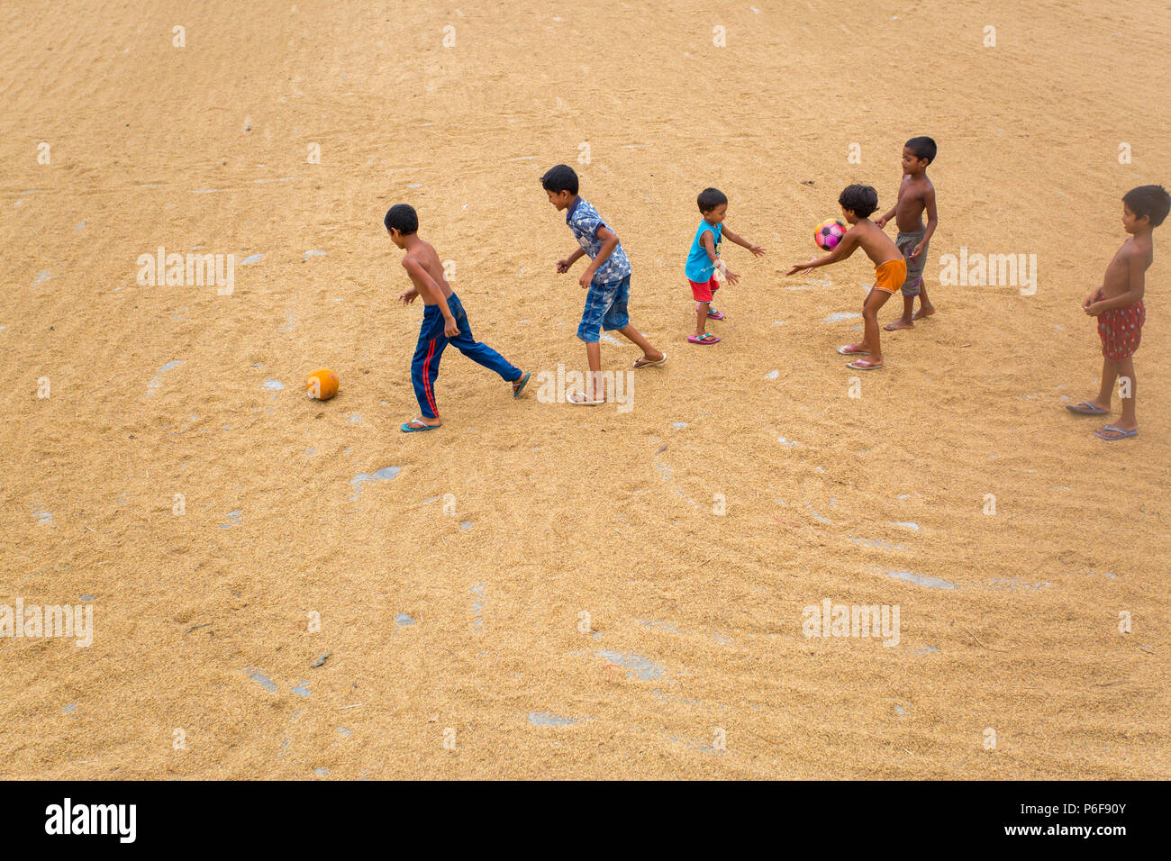 Indian kids playing football hi-res stock photography and images - Alamy