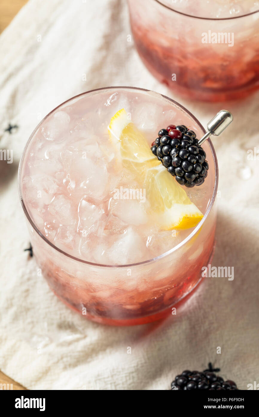 Alcoholic Blackberry Gin Bramble Cocktail with Lemon Stock Photo - Alamy