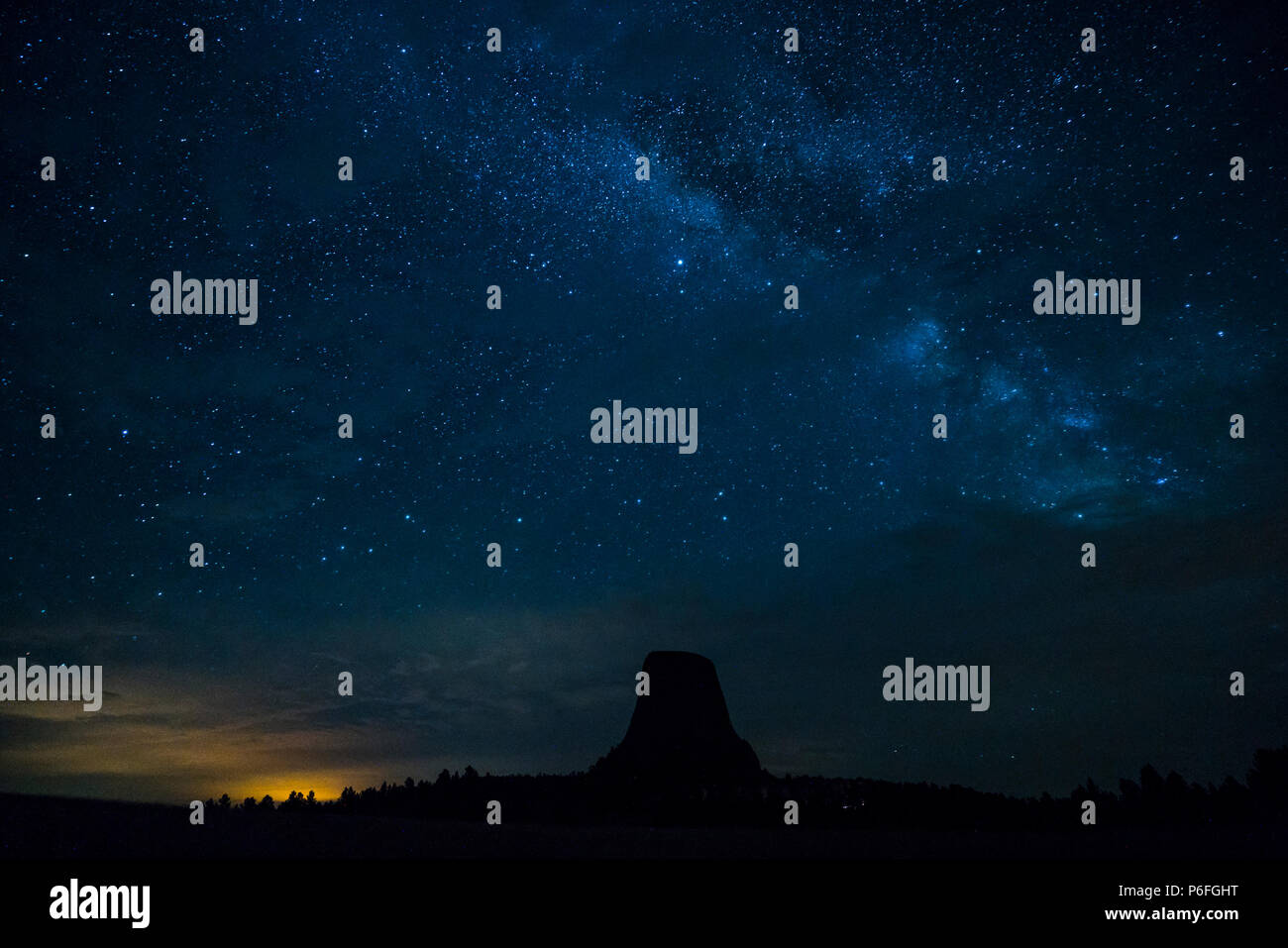 beautiful devil tower at night with milkyway in clear night sky ...