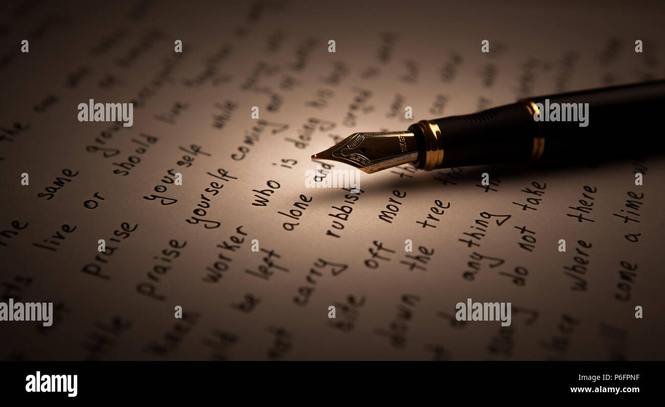 fountain pen on text sheet paper closeup Stock Photo - Alamy