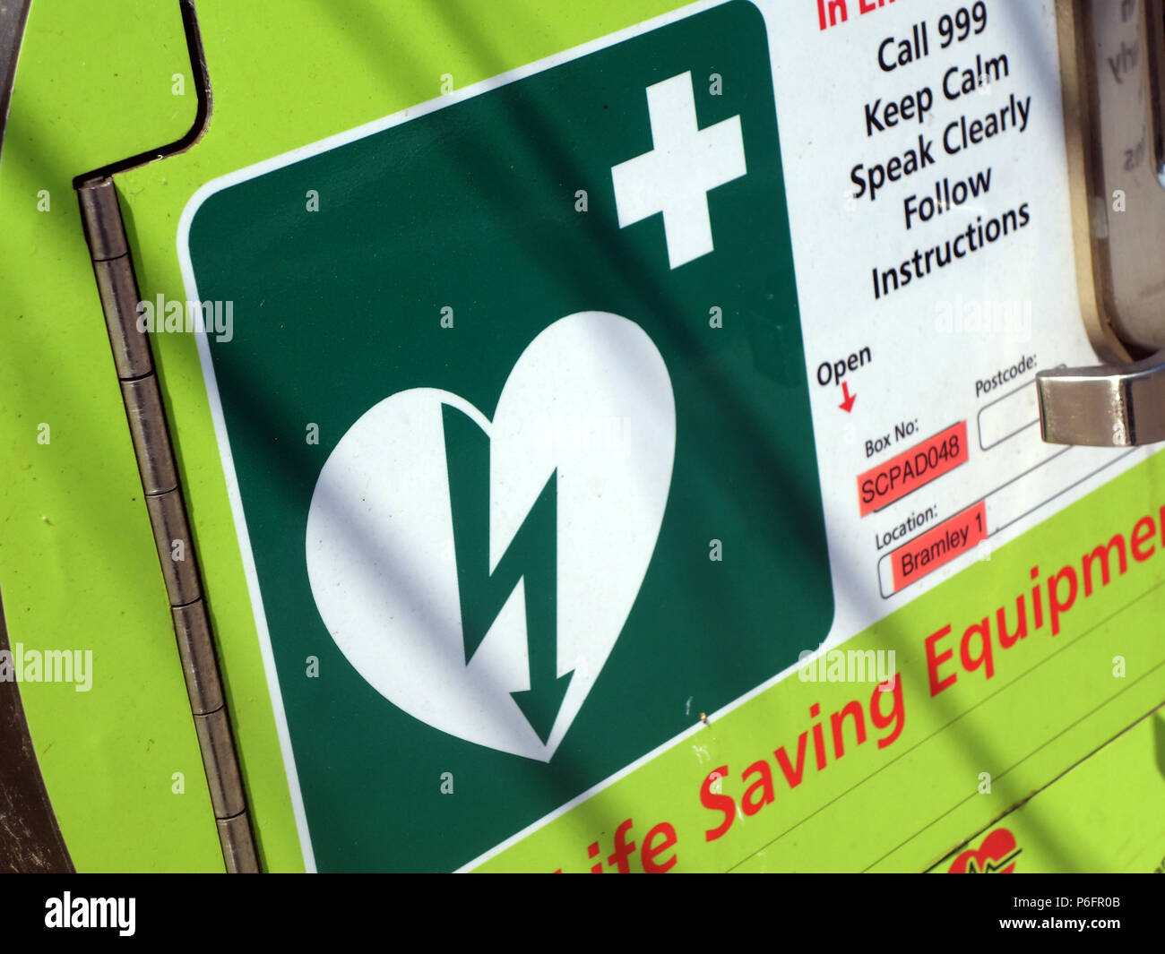 Life saving Defibrillator mounted on the local village hall wall in ...