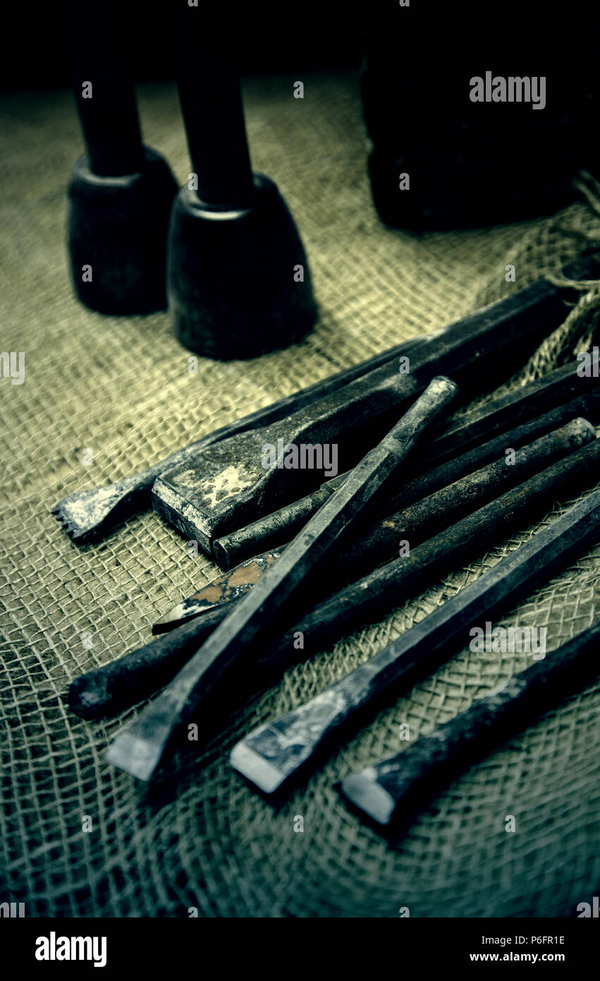 Old tools for carving stone of handmade way, detail of old manual craft ...