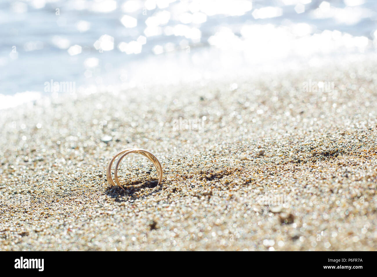 Wedding rings on beach vacation hi-res stock photography and images - Alamy