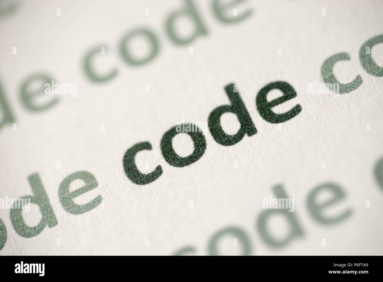 word code printed on white paper macro Stock Photo - Alamy