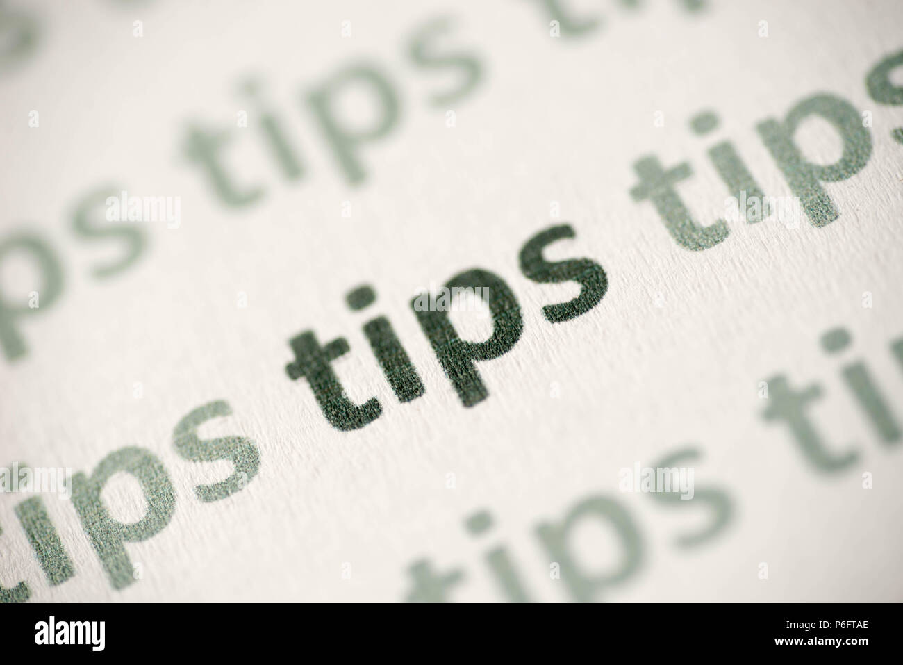 word tips printed on white paper macro Stock Photo - Alamy