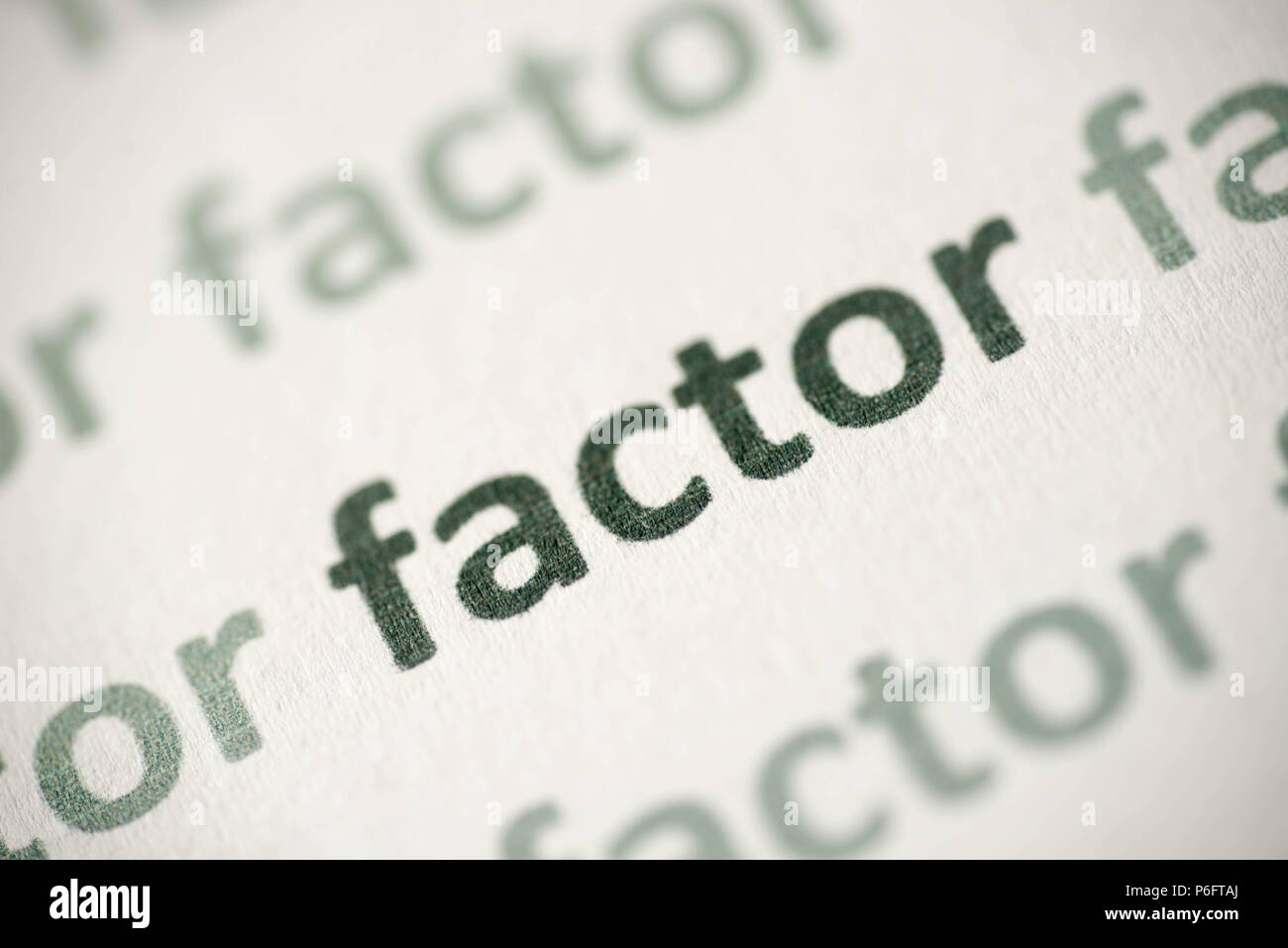 word factor printed on white paper macro Stock Photo - Alamy