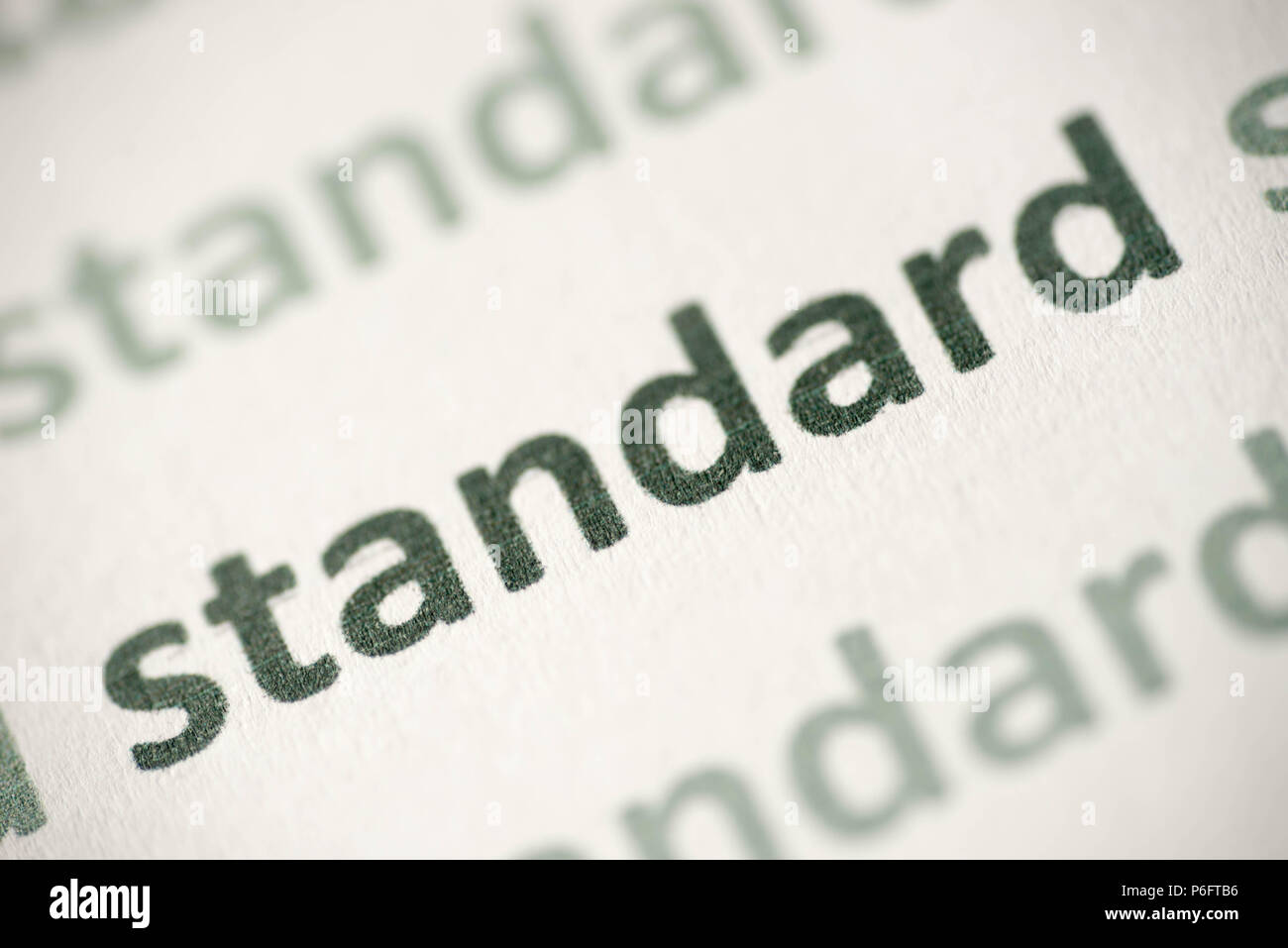 word standard printed on white paper macro Stock Photo - Alamy