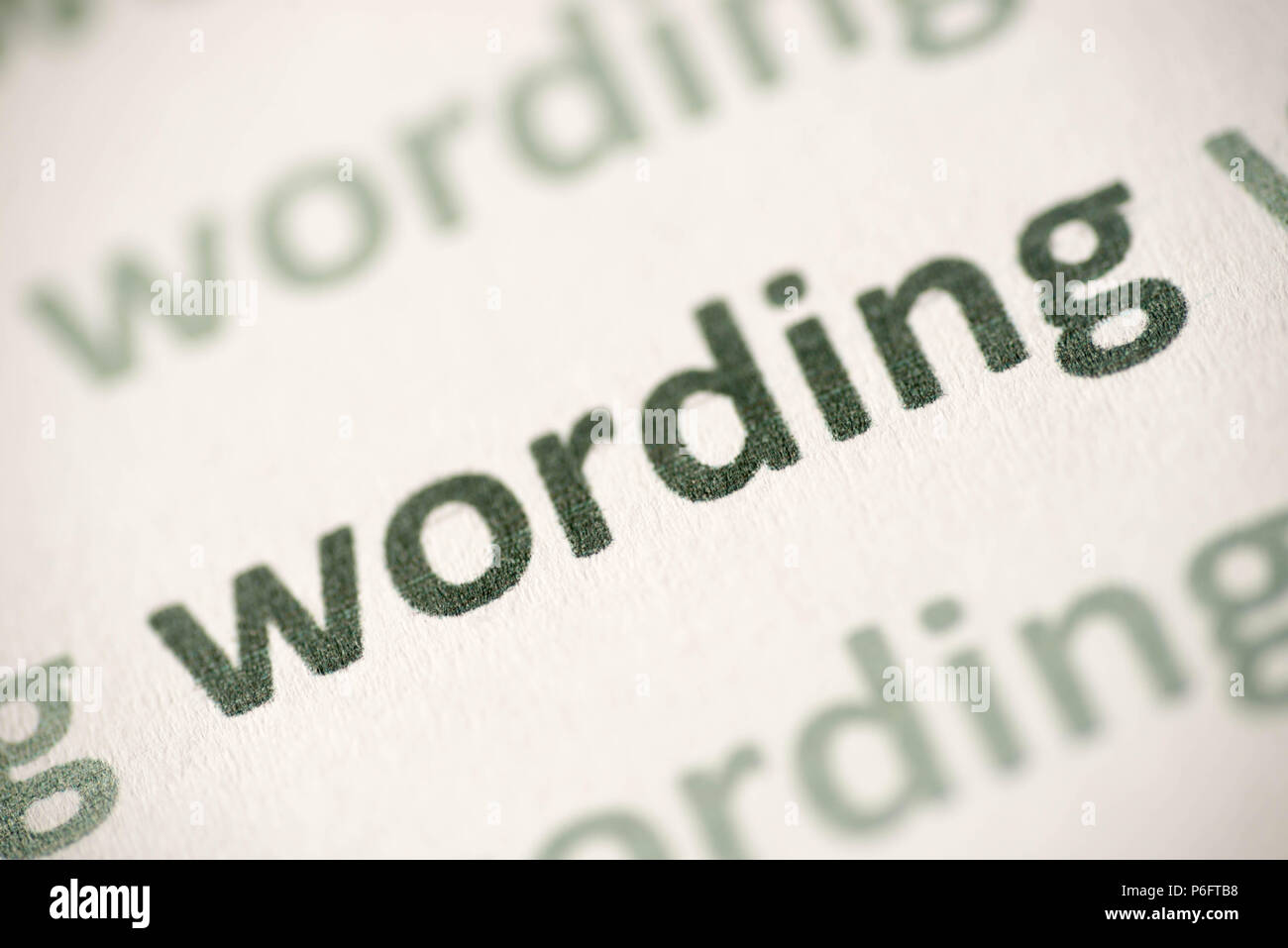 word wording printed on white paper macro Stock Photo - Alamy