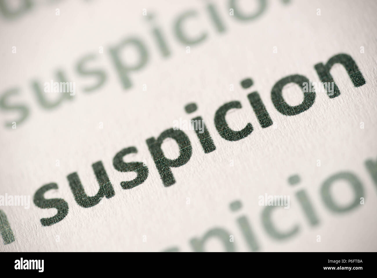 word suspicion printed on white paper macro Stock Photo - Alamy