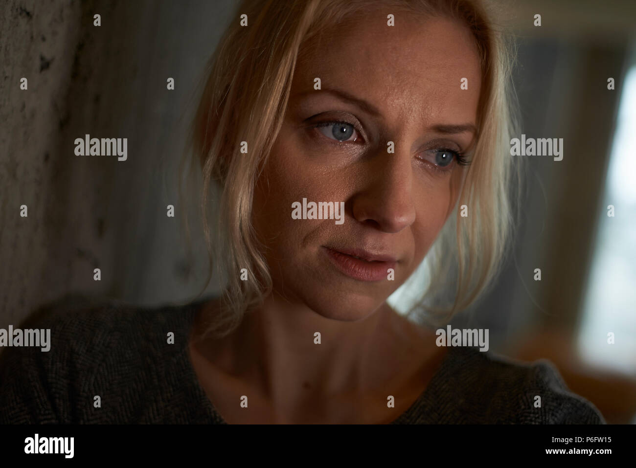 Close up of a beautiful young caucasian woman looking sad and upset ...