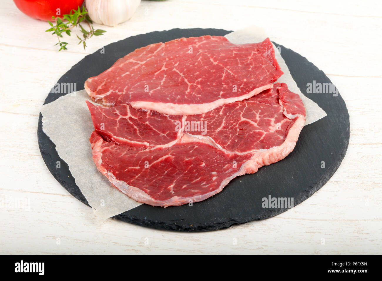 Raw beef steak ready for cooking Stock Photo - Alamy