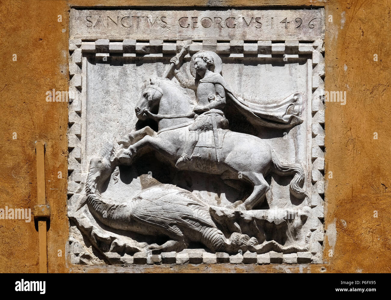 Saint George slaying the dragon, relief on house facade in Venice ...