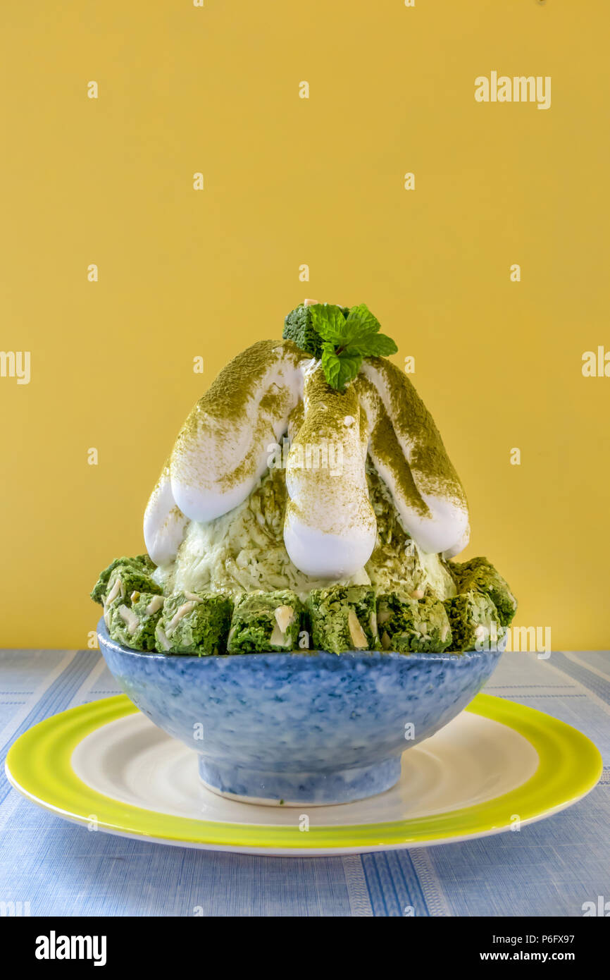 Bingsu - Korean shaved ice dessert with sweet toppings with green tea ...