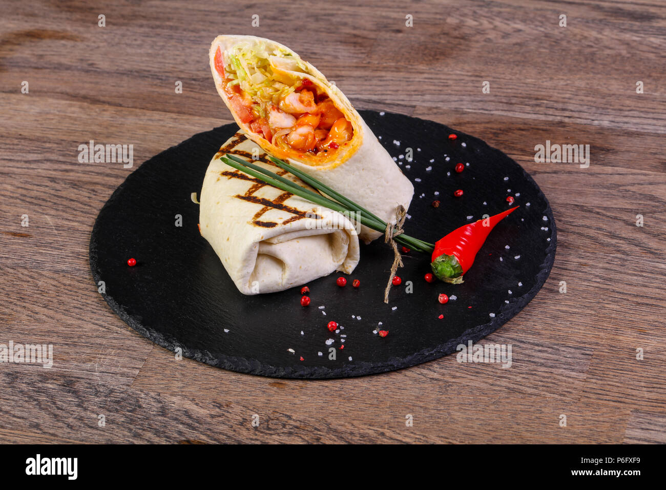 Chicken roll with tortilla served pepper Stock Photo - Alamy