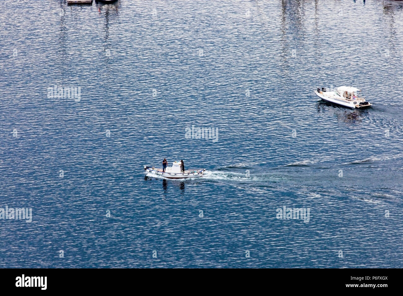 Two boats in the sea, near a harbour Stock Photo - Alamy