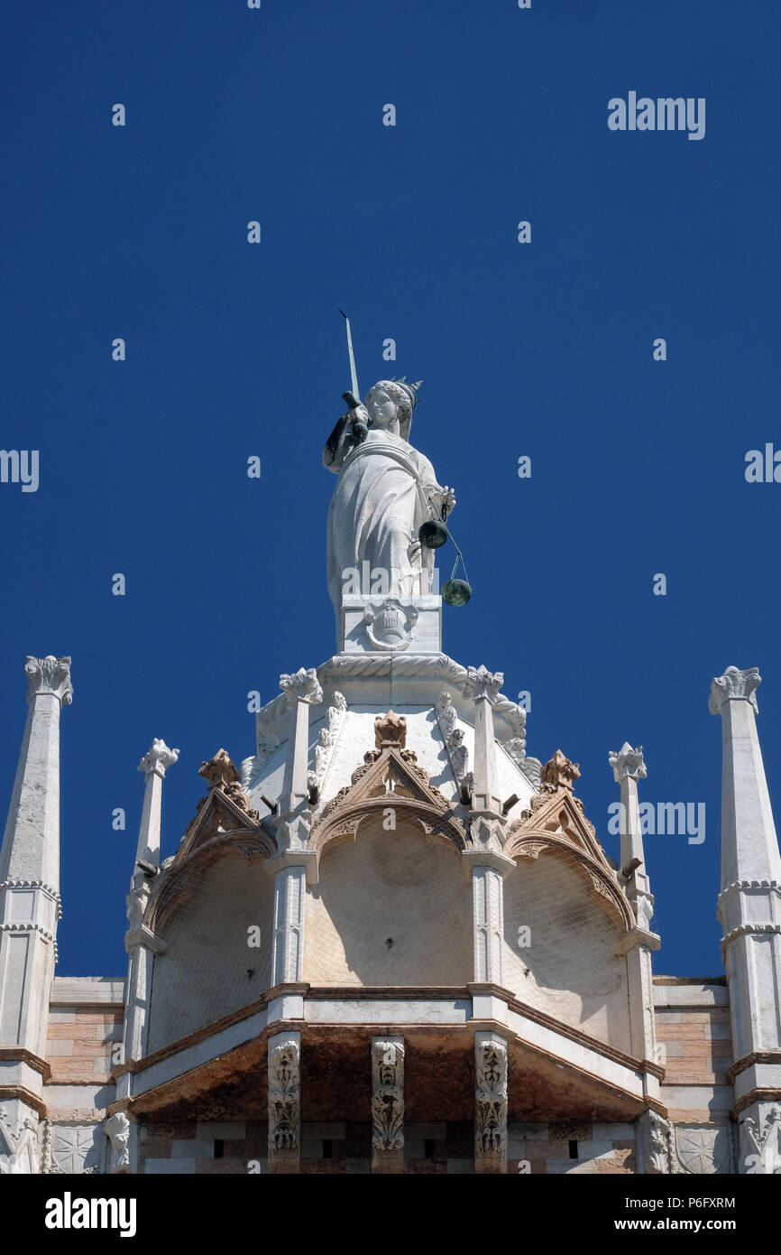 Goddess of Justice, statue at the top of Doge Palace in Venice, holding ...