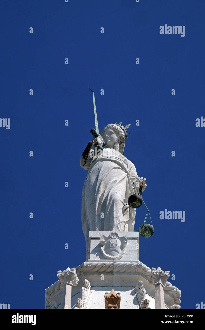 Goddess of Justice, statue at the top of Doge Palace in Venice, holding ...