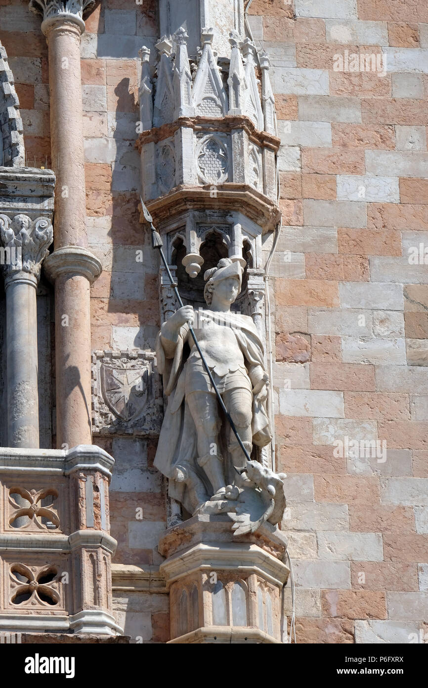 Statue of Saint George, detail of the Doge Palace, St. Mark Square ...