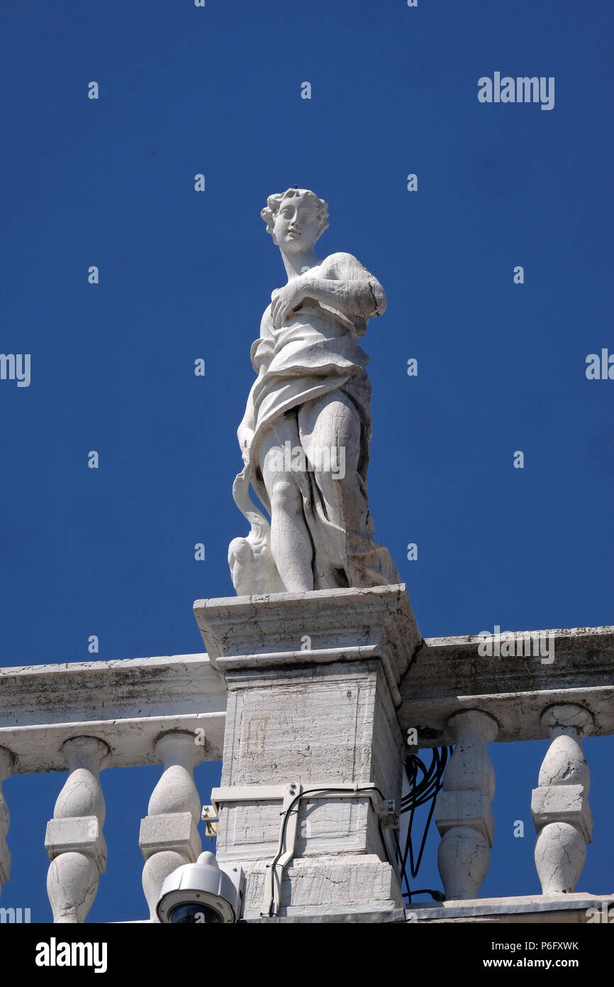 Statue at the top of National Library of St Mark`s Biblioteca Marciana ...