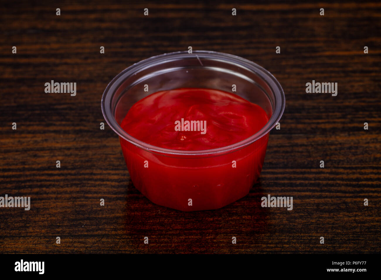 Ketchup sauce portion over wooden Stock Photo - Alamy