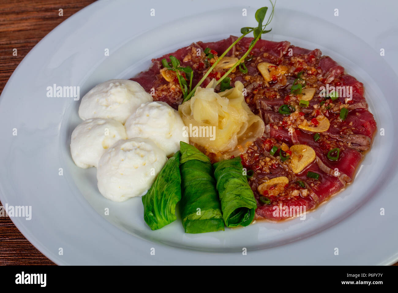 Raw Japanese young Beef carpaccio Stock Photo - Alamy