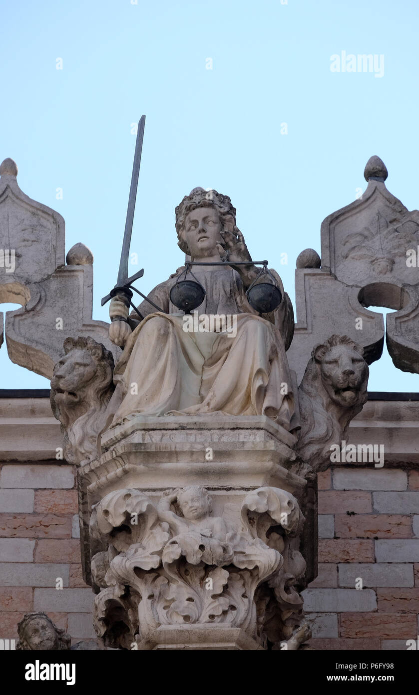Goddess of Justice, statue at the top of Doge Palace in Venice, holding ...