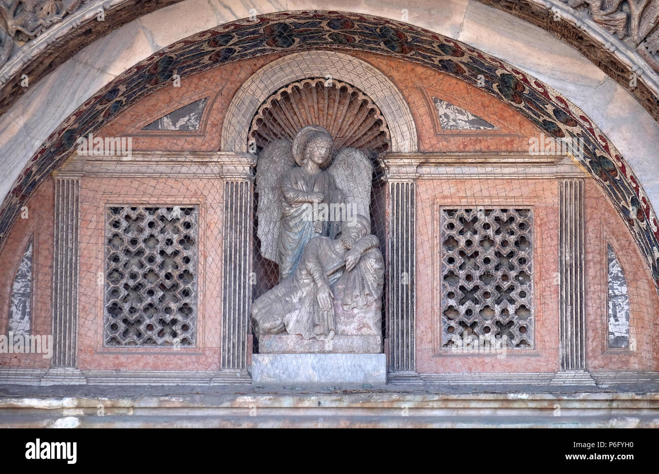 Relief arch over the gate to the Saint Marks Basilica, Venice, Italy ...