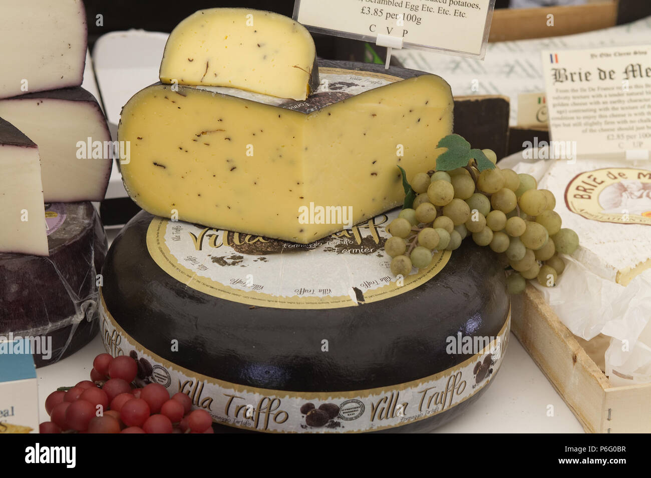Truffle Gouda cheese and grapes Stock Photo - Alamy